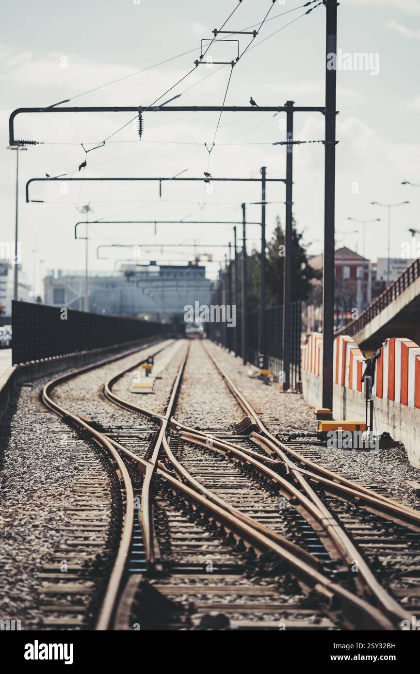 Vertical telephoto shot of railway tracks with multiple switches and ...