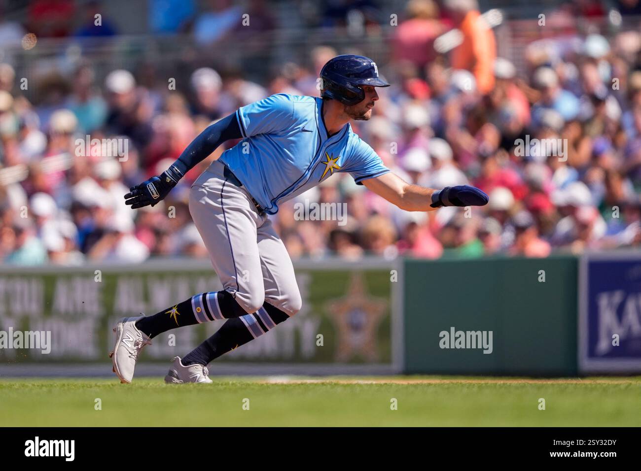 Tampa Bay Rays Josh Lowe runs back to first to avoid a tag in the third ...