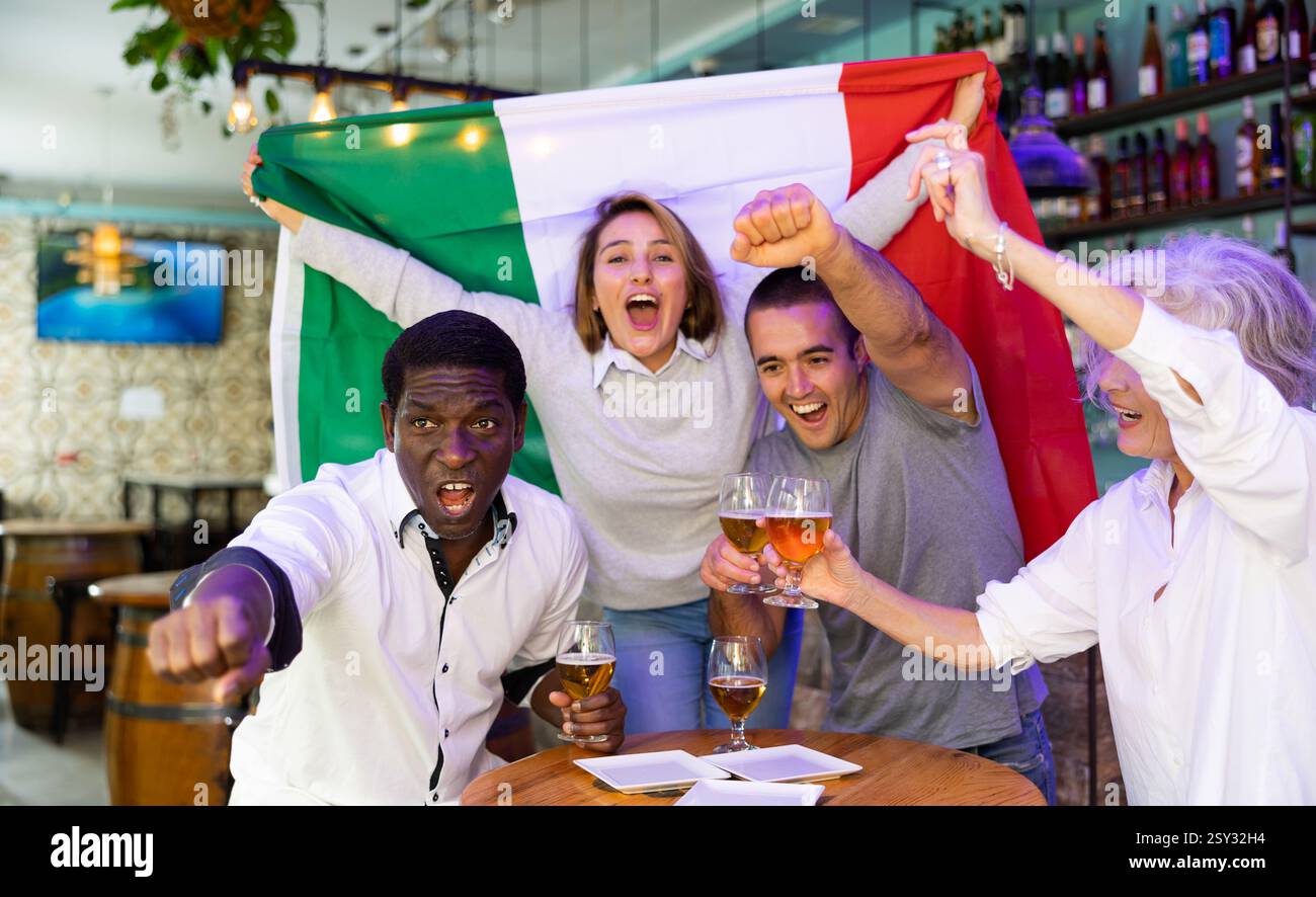 Extremely happy italian man and woman supporters waving national flag ...