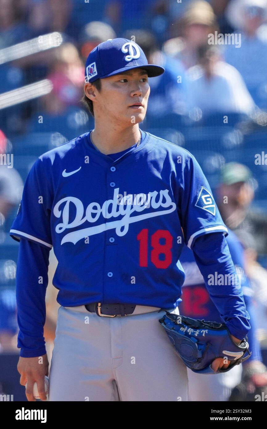 Los Angeles Dodgers pitcher Yoshinobu Yamamoto (18) gets ready to throw ...