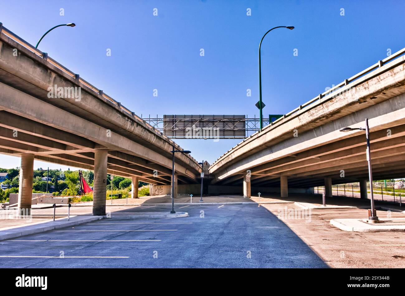Freeway with a large overpass and a sign that says "No Parking". The ...