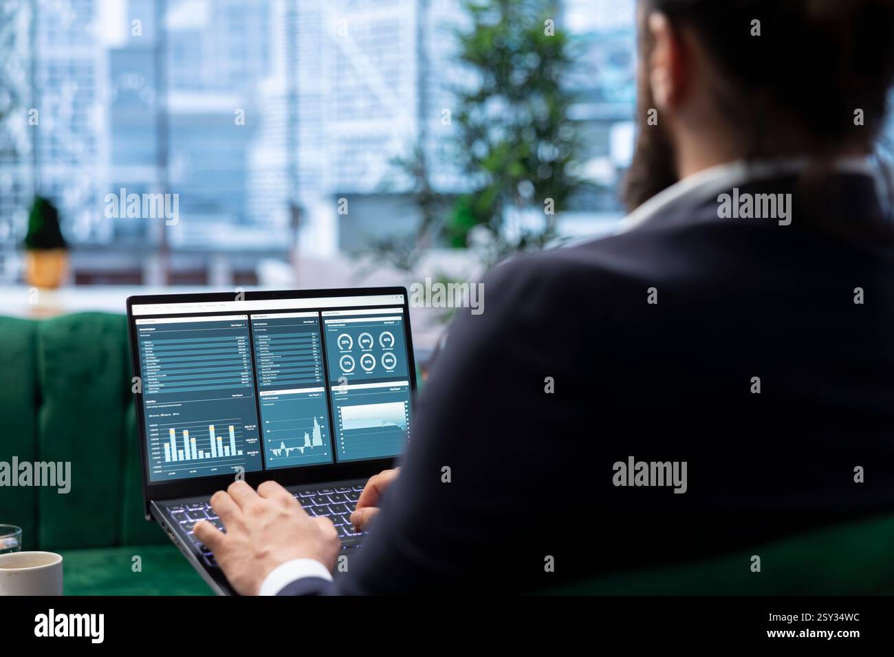 Determined CEO works in office analyzing infographics and setting ...