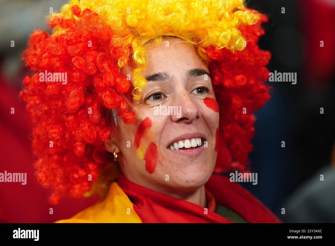 A Spain fan with face paint and a wig after the final whistle in the ...