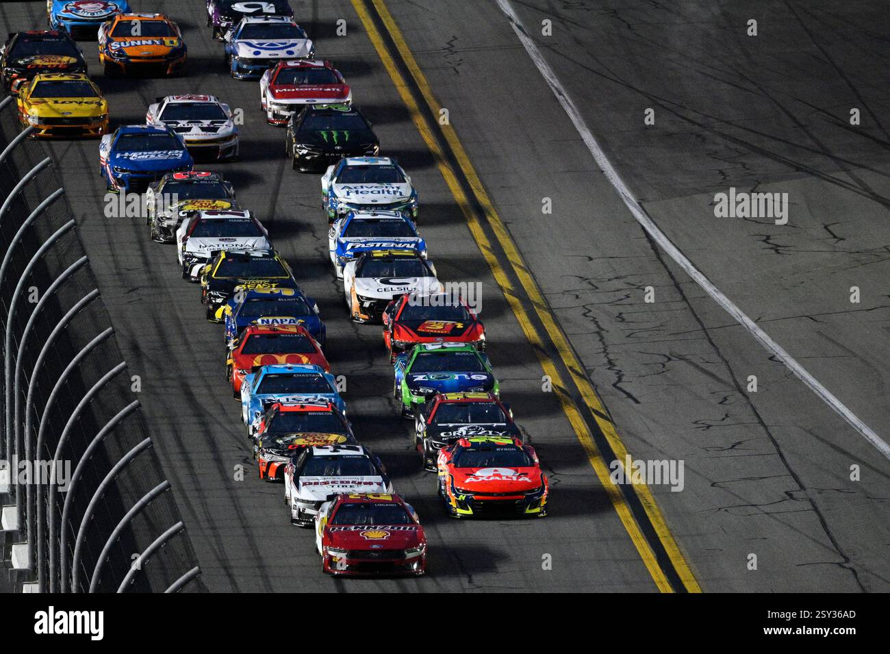 Joey Logano (22) and William Byron (24) lead drivers through the front ...