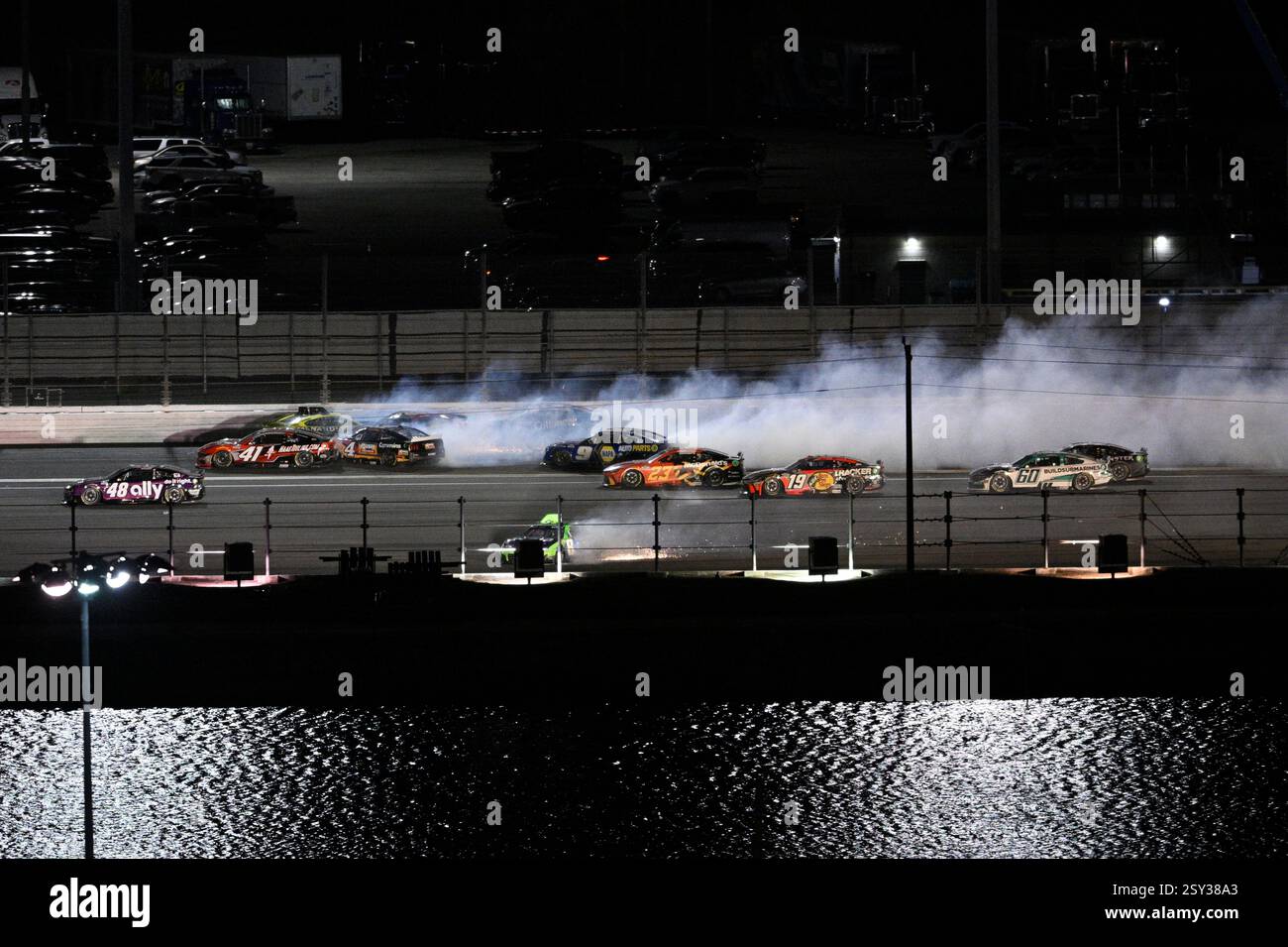 Drivers get involved in a collision on the back stretch during the ...