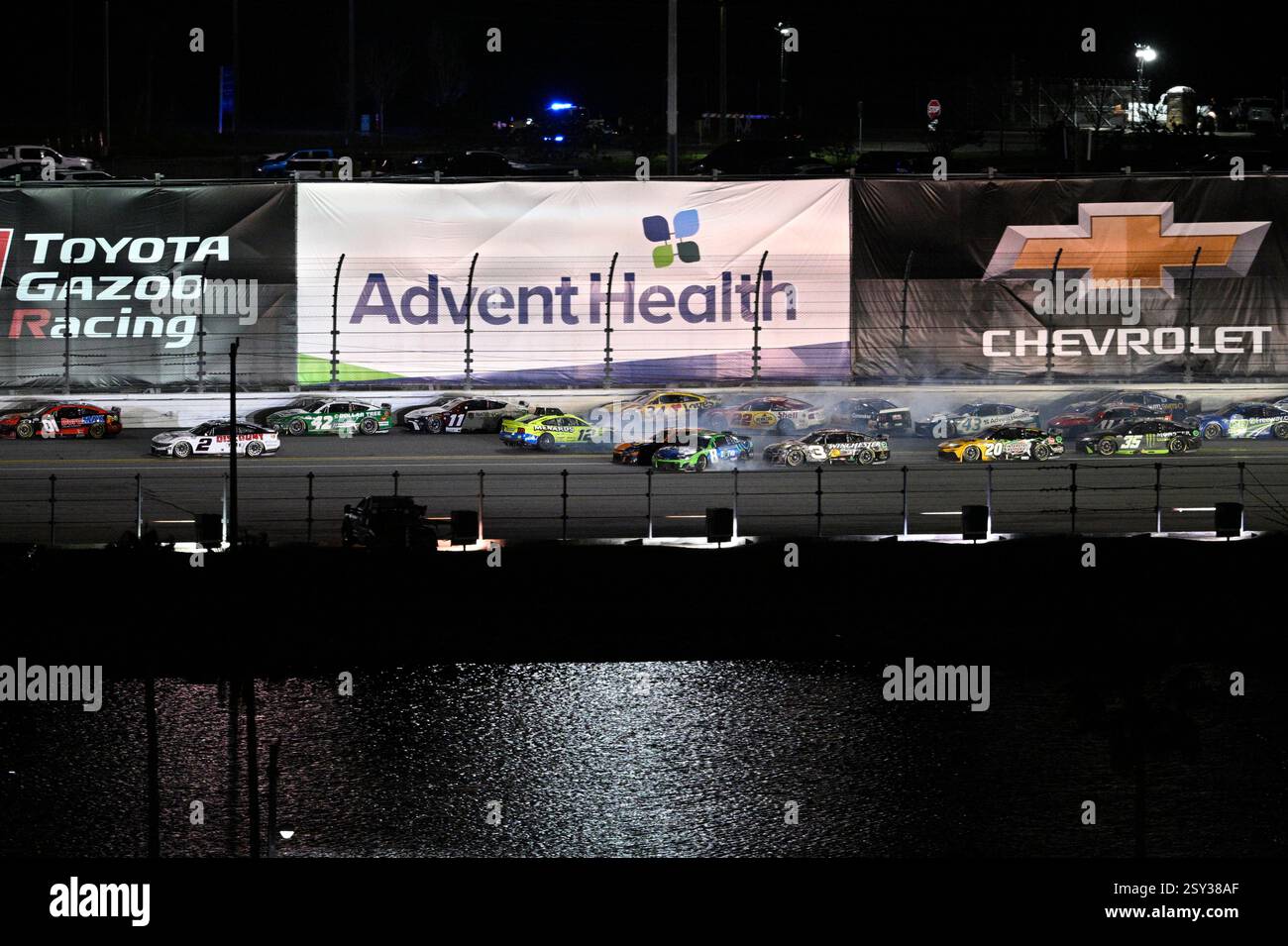Drivers get involved in a collision on the back stretch during the ...