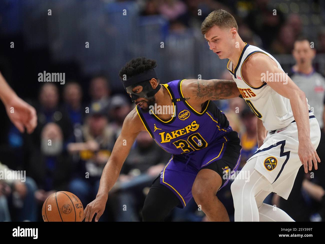 Los Angeles Lakers guard Jordan Goodwin (30) and Denver Nuggets guard ...