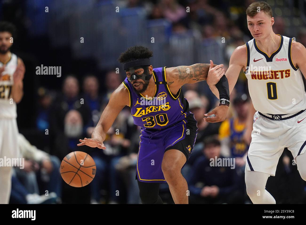 Los Angeles Lakers guard Jordan Goodwin (30) and Denver Nuggets guard ...