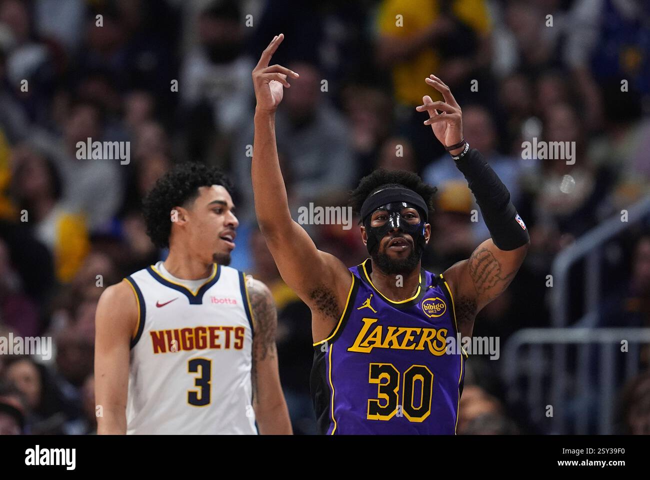 Los Angeles Lakers guard Jordan Goodwin (30) and Denver Nuggets guard ...
