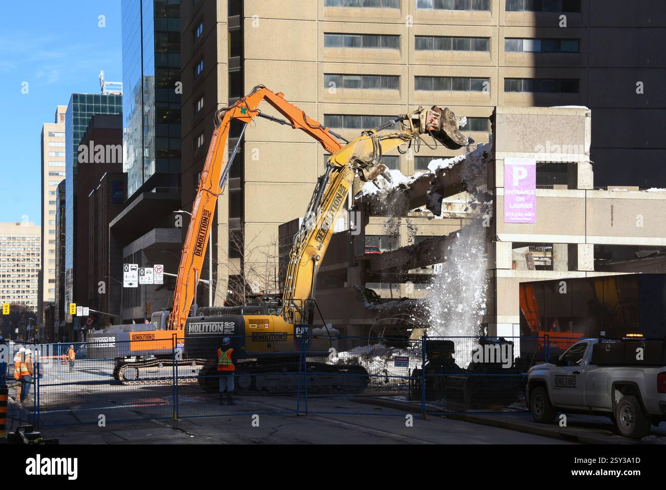 Ottawa, Canada - February 26, 2024: Cranes work to clear snow and ...