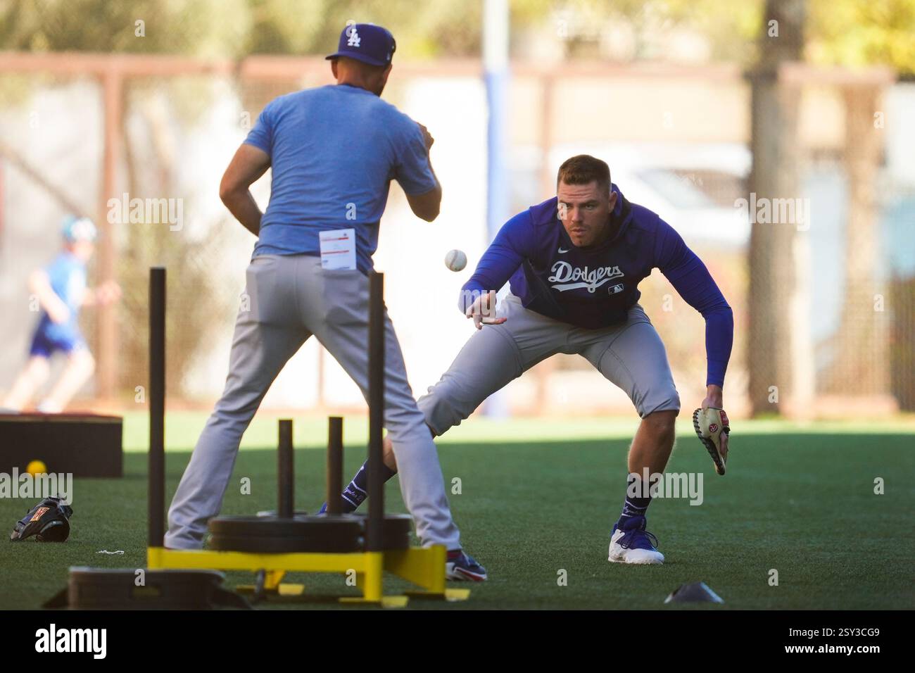 Los Angeles Dodgers first baseman Freddie Freeman, right, works out ...