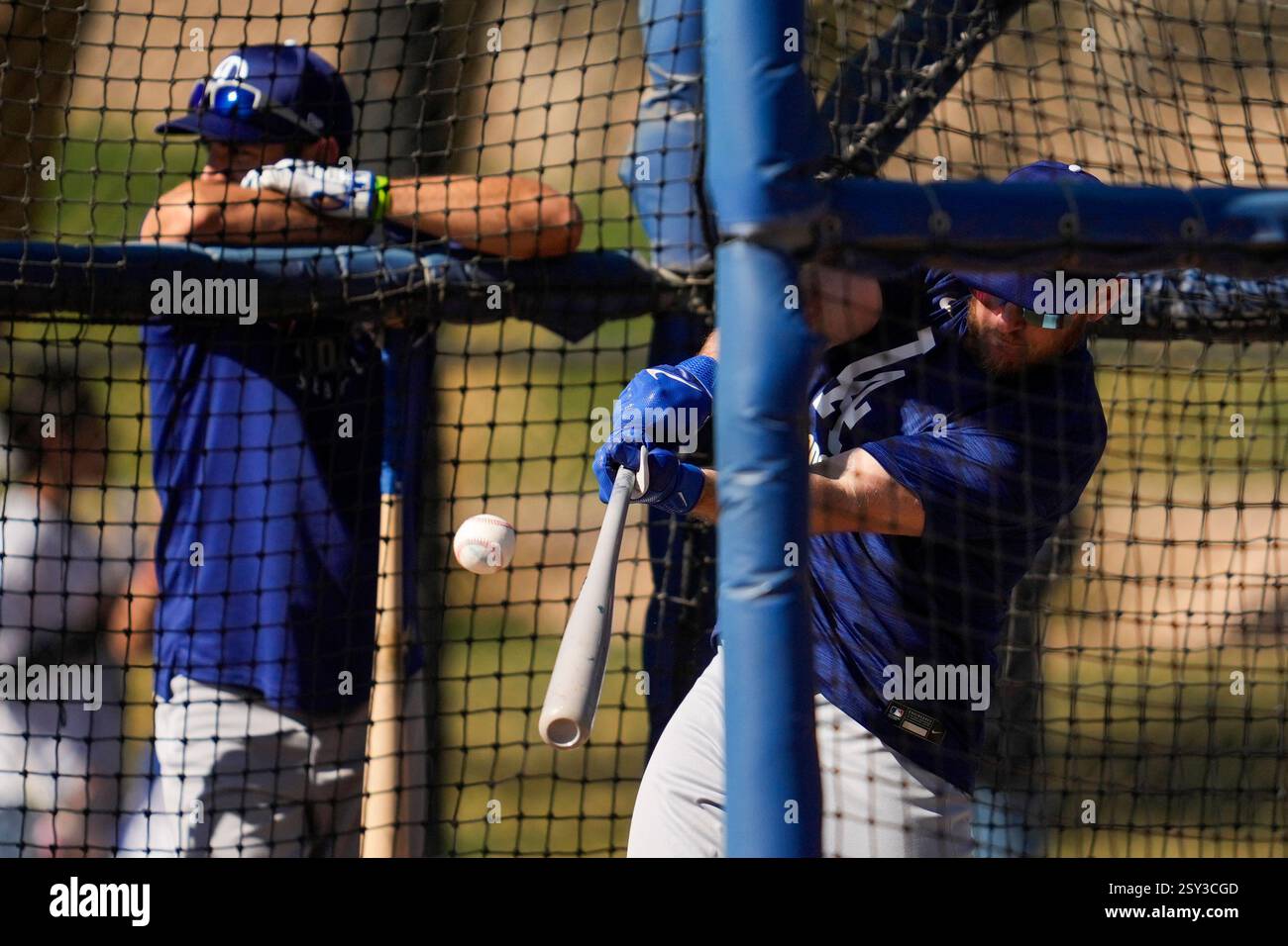 Los Angeles Dodgers' Max Muncy hits during a spring training baseball ...