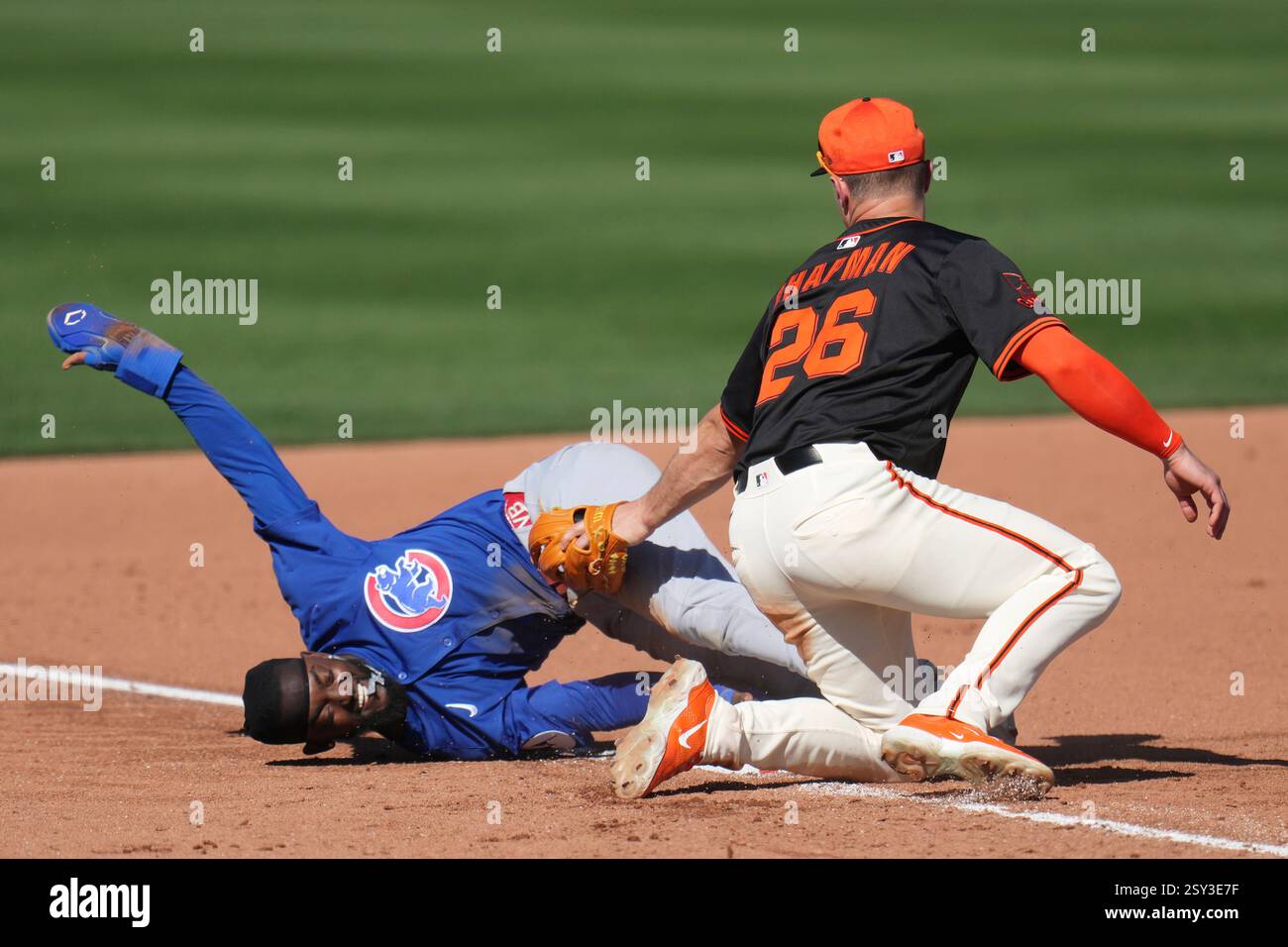 Chicago Cubs' Vidal Bruján, left, steals third base as San Francisco ...