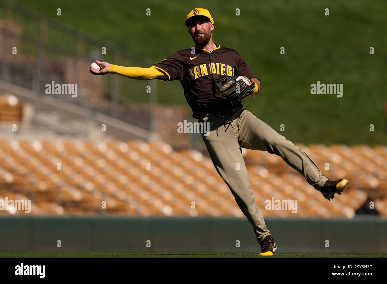 San Diego Padres shortstop Mason McCoy throws a ball to first base hit ...