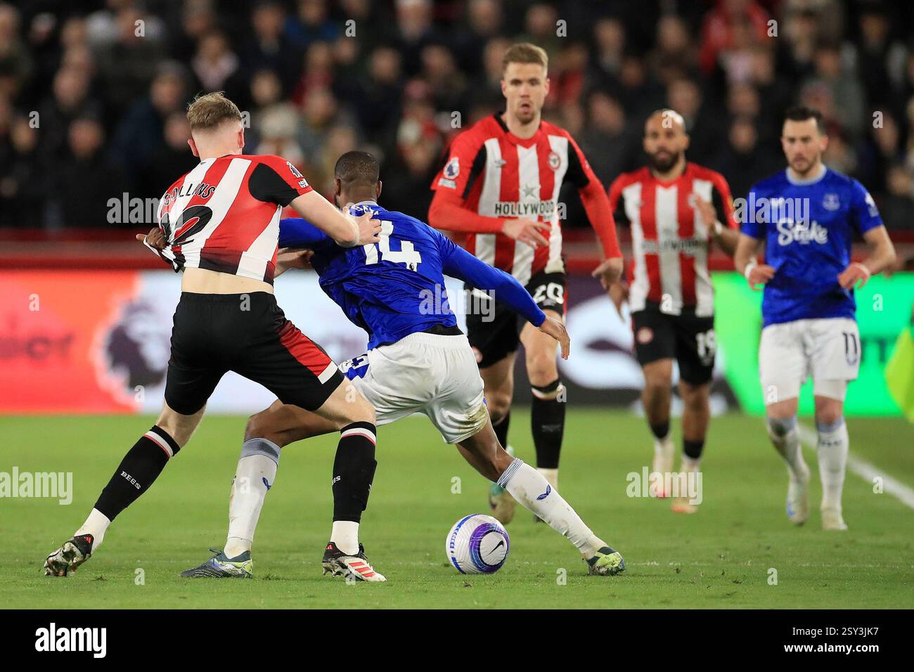 Forward: Beto (14) of Everton fending off Defender: Nathan Collins (22 ...