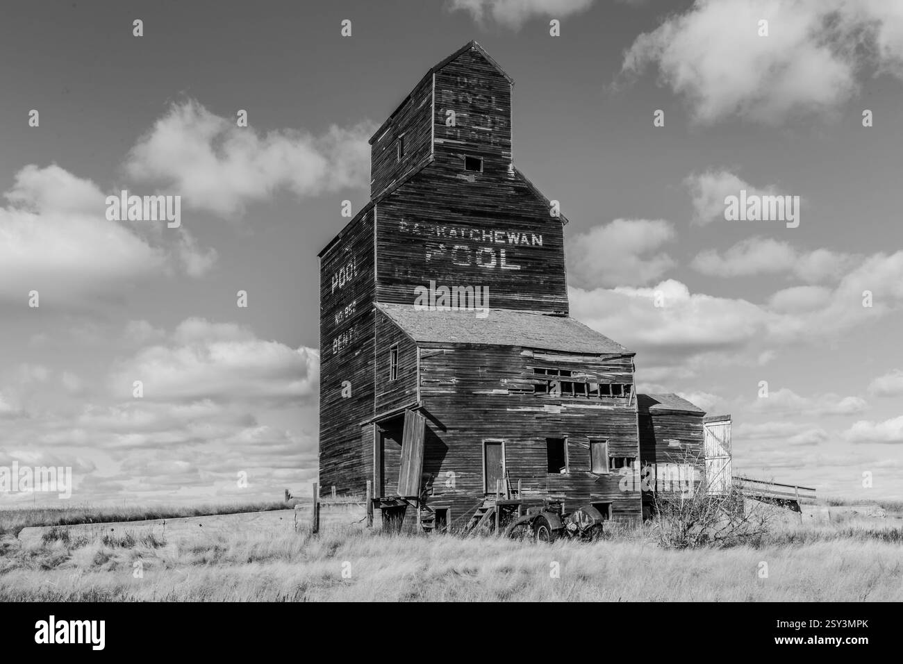 Large, old grain silo with the words DeWitt Chapman Co. On it. The silo ...