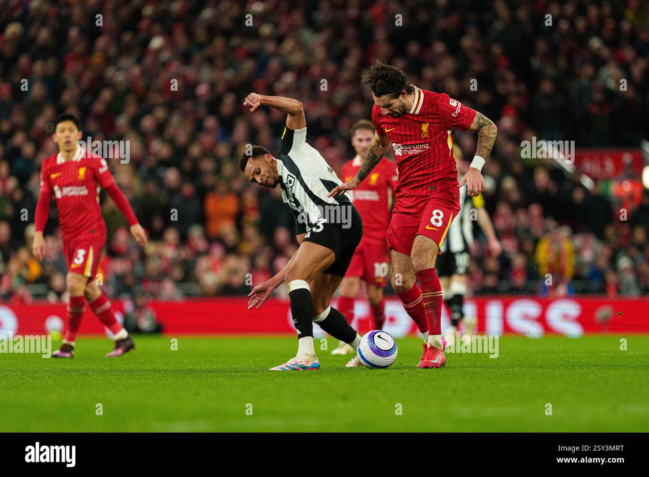 Newcastle United's Jacob Murphy battles for possession with Liverpool's ...