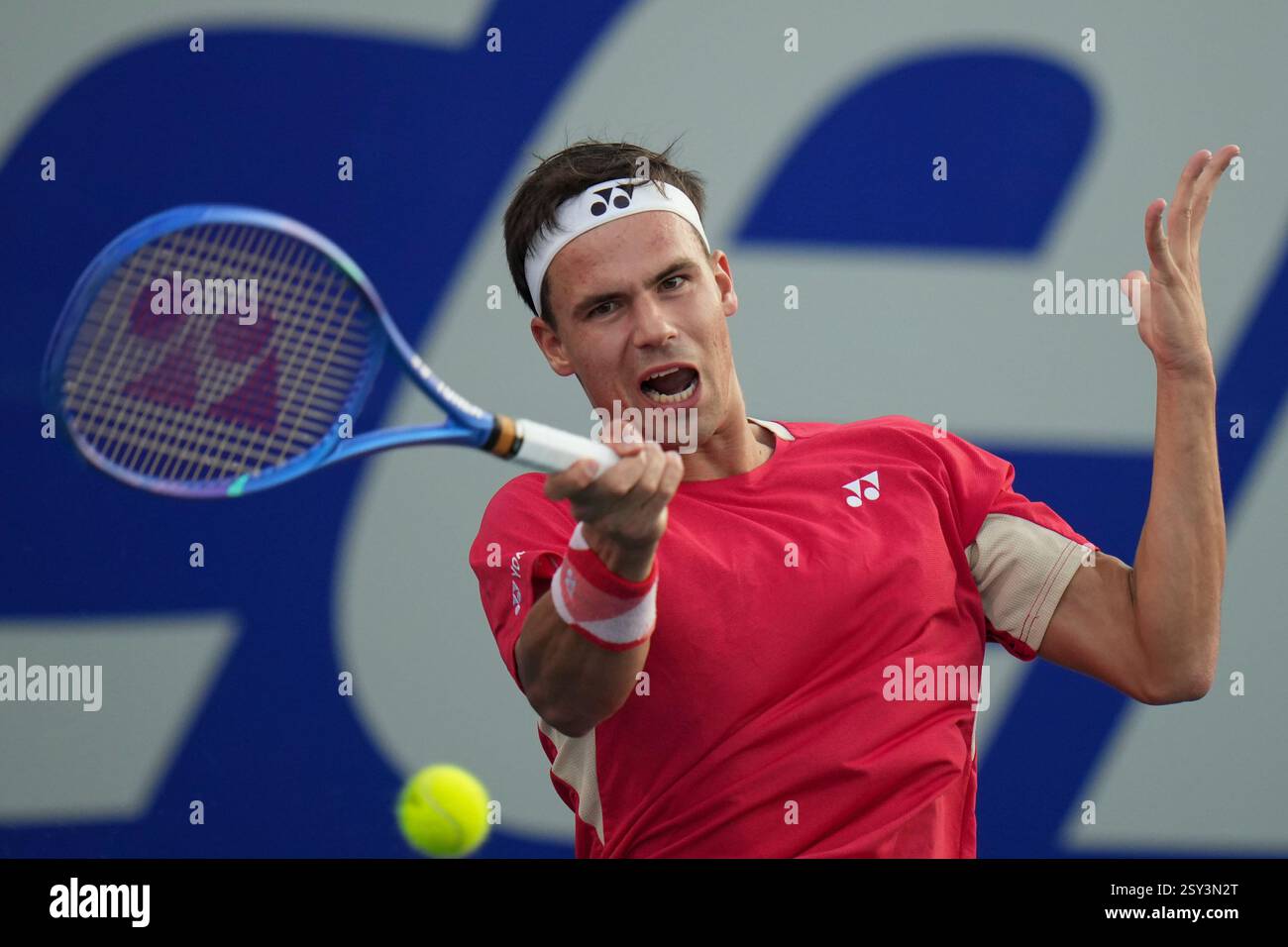 Daniel Altmaier of Germany hits a return to Tomas Machac of Czechia ...