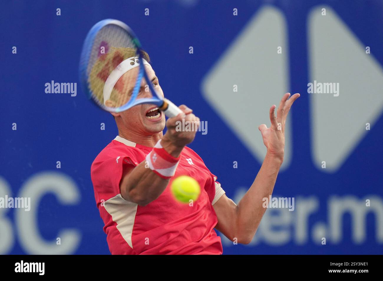 Daniel Altmaier of Germany hits a return to Tomas Machac of Czechia ...