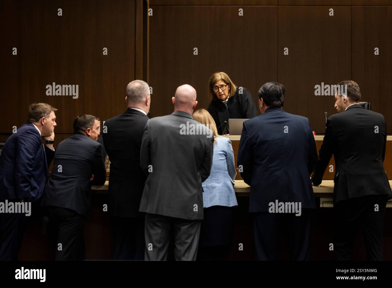 Judge Victoria A. Rossetti speaks with the prosecution and defense ...