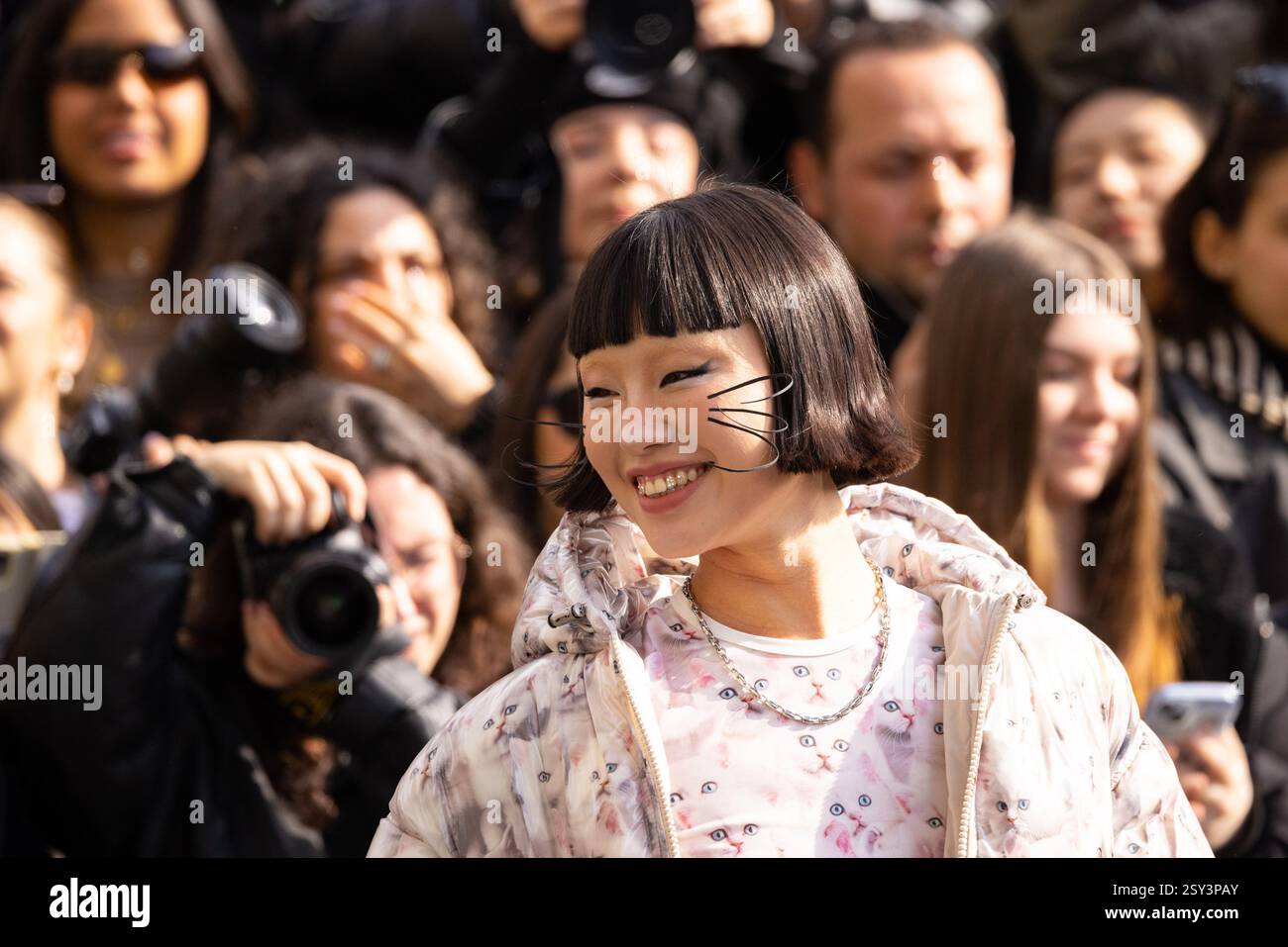 Lin Lin (with cat whiskers) is seen at the Diesel fashion show during ...