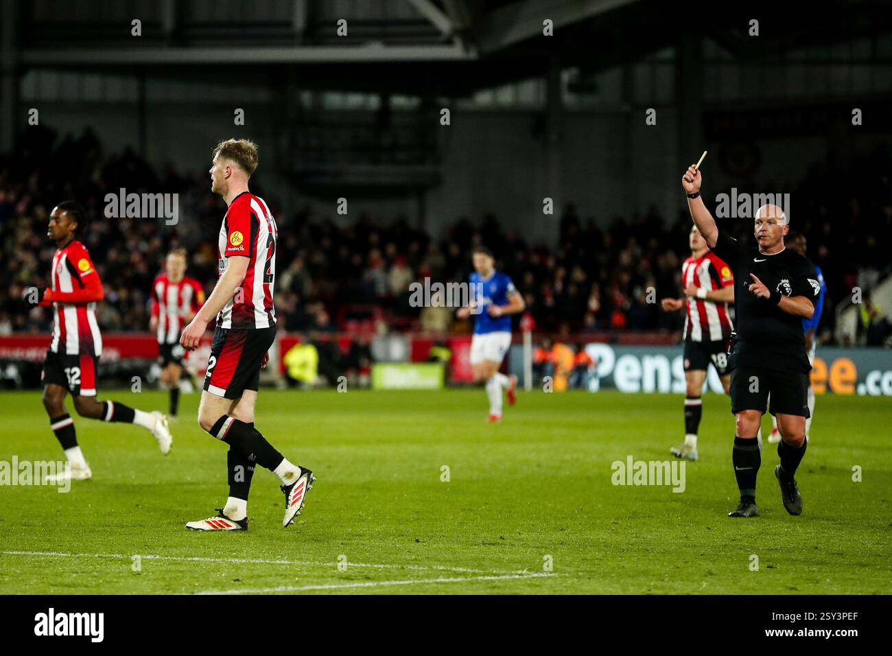 Nathan Collins of Brentford receives a yellow card from Referee Simon ...