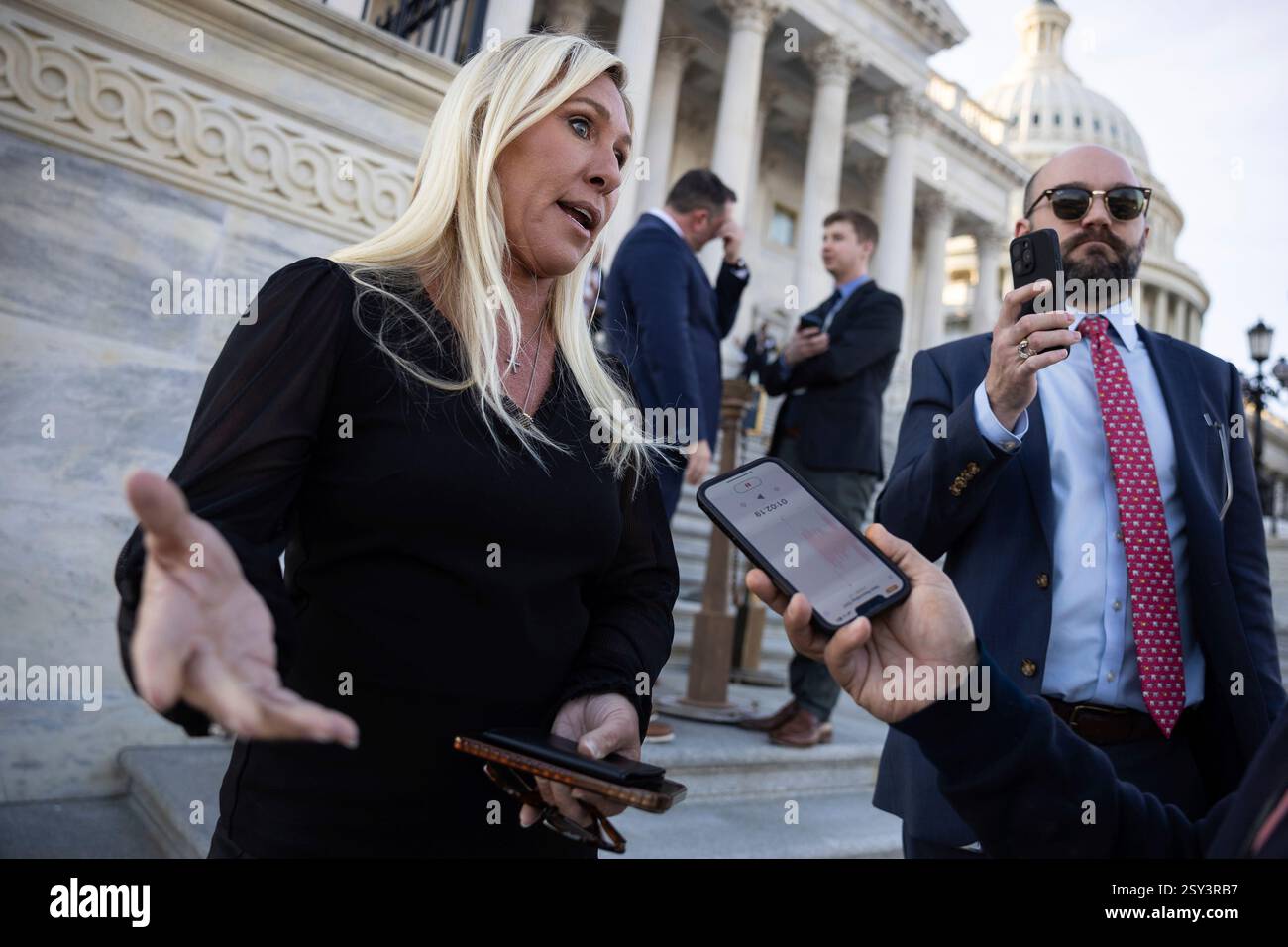 Rep. Marjorie Taylor Greene (R-Ga.) speaks with reporters as she ...