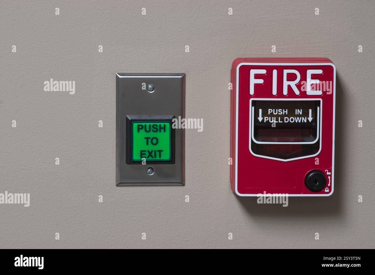 Fire alarm pull box and a push to exit button Stock Photo - Alamy