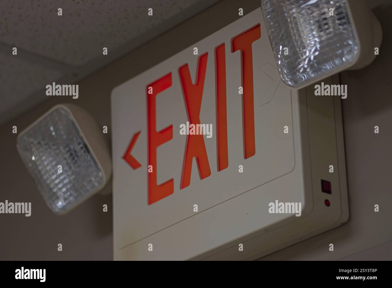 Emergency exit sign with flood lights Stock Photo - Alamy