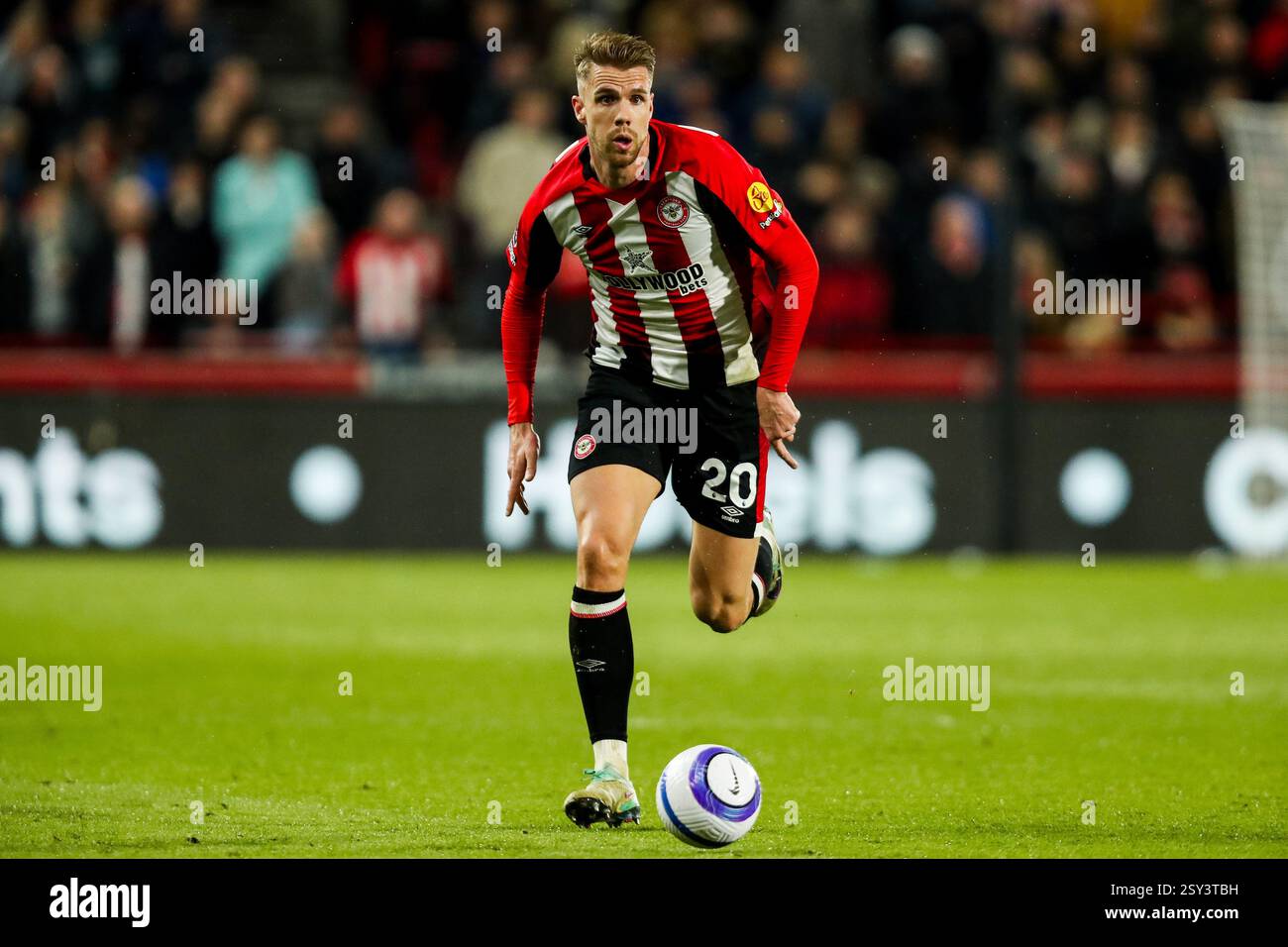 London, UK. 26th Feb, 2025. Kristoffer Ajer of Brentford breaks with ...