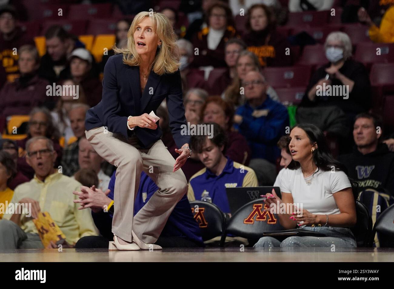 Washington head coach Tina Langley watches play during the first half ...