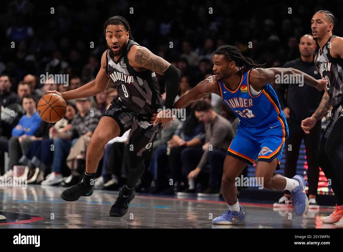 Brooklyn Nets' Trendon Watford (9) drives past Oklahoma City Thunder's ...