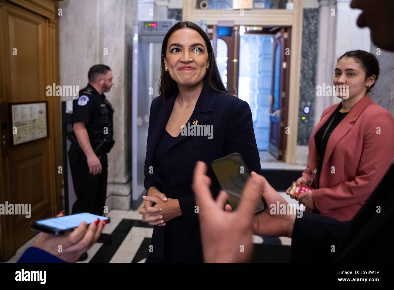 Rep. Alexandria Ocasio-Cortez (D-N.Y.) speaks with reporters as she ...