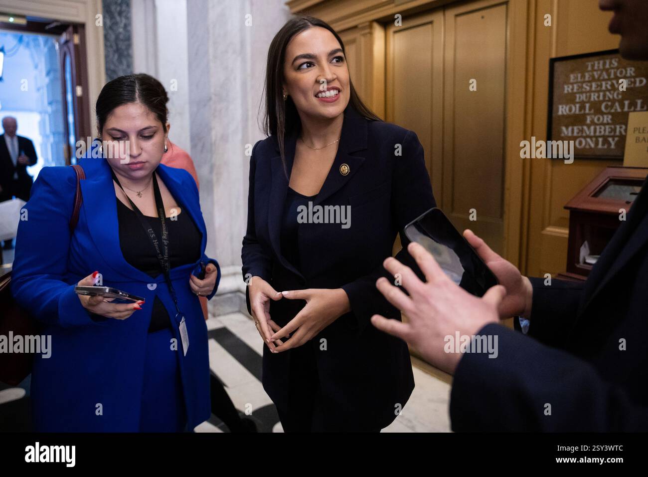 Rep. Alexandria Ocasio-Cortez (D-N.Y.) speaks with reporters as she ...