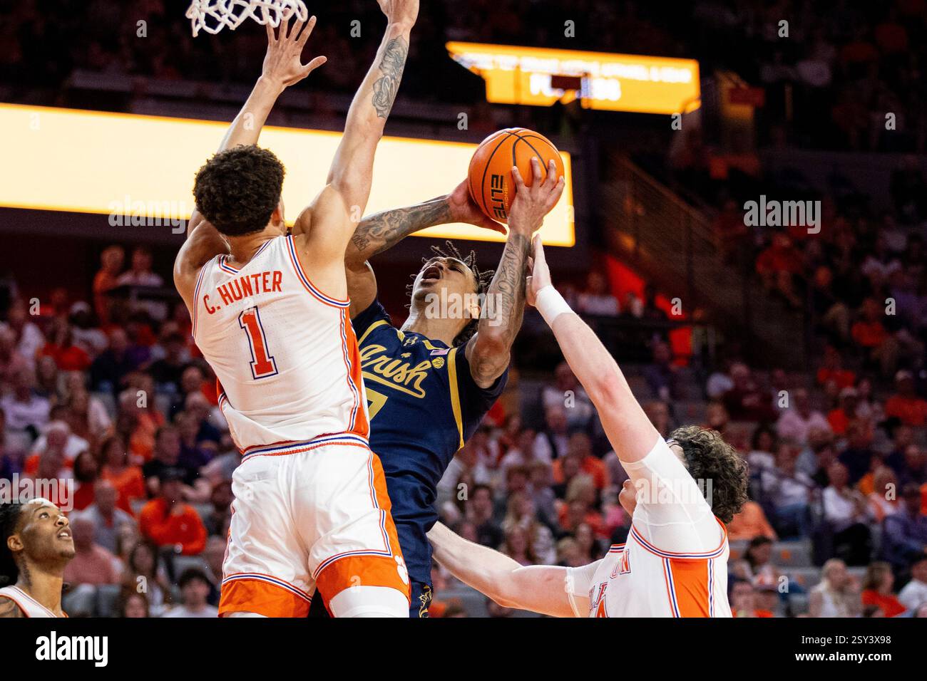Notre Dame forward Tae Davis shoots on Clemson guard Chase Hunter (1 ...