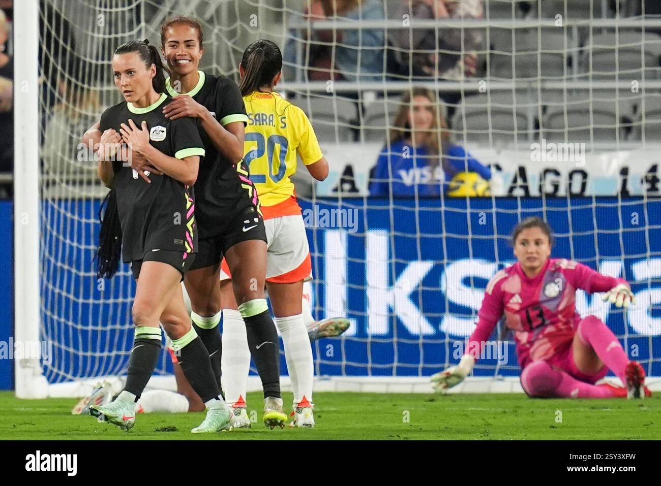 Australia forward Hayley Raso, left, celebrates her goal with teammate ...