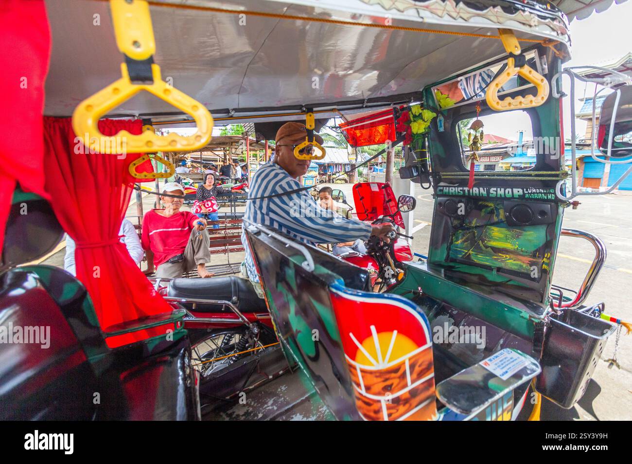 Colorful tricycles lined up in hi-res stock photography and images - Alamy
