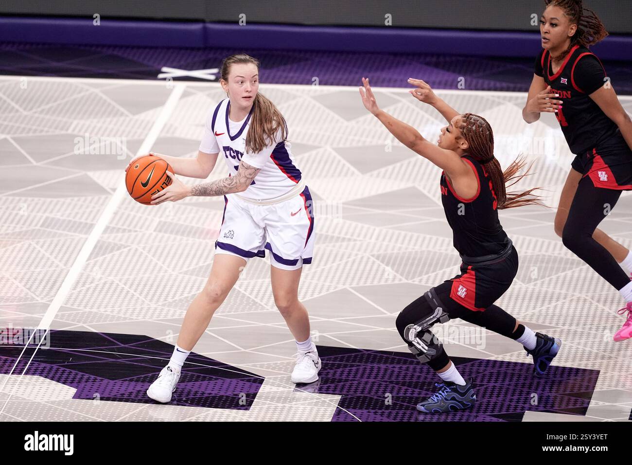 TCU guard Madison Conner, left, looks to make a pass as Houston's Gigi ...