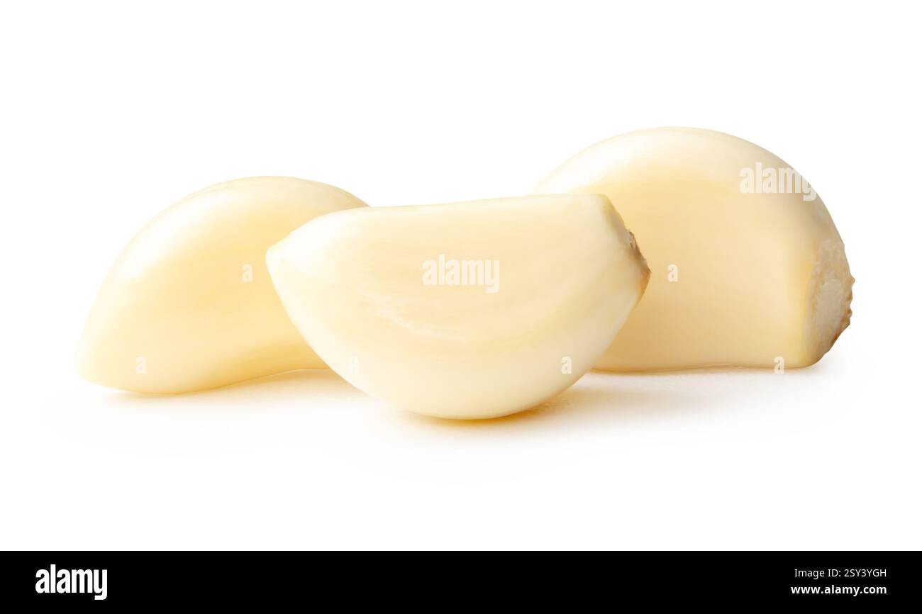 Side view of peeled garlic cloves or pieces in stack is isolated on ...