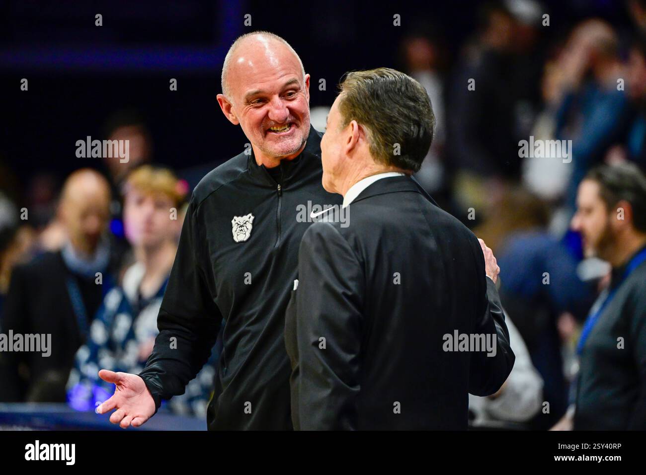 Butler head coach Thad Matta, left, talks with St. John's head coach ...
