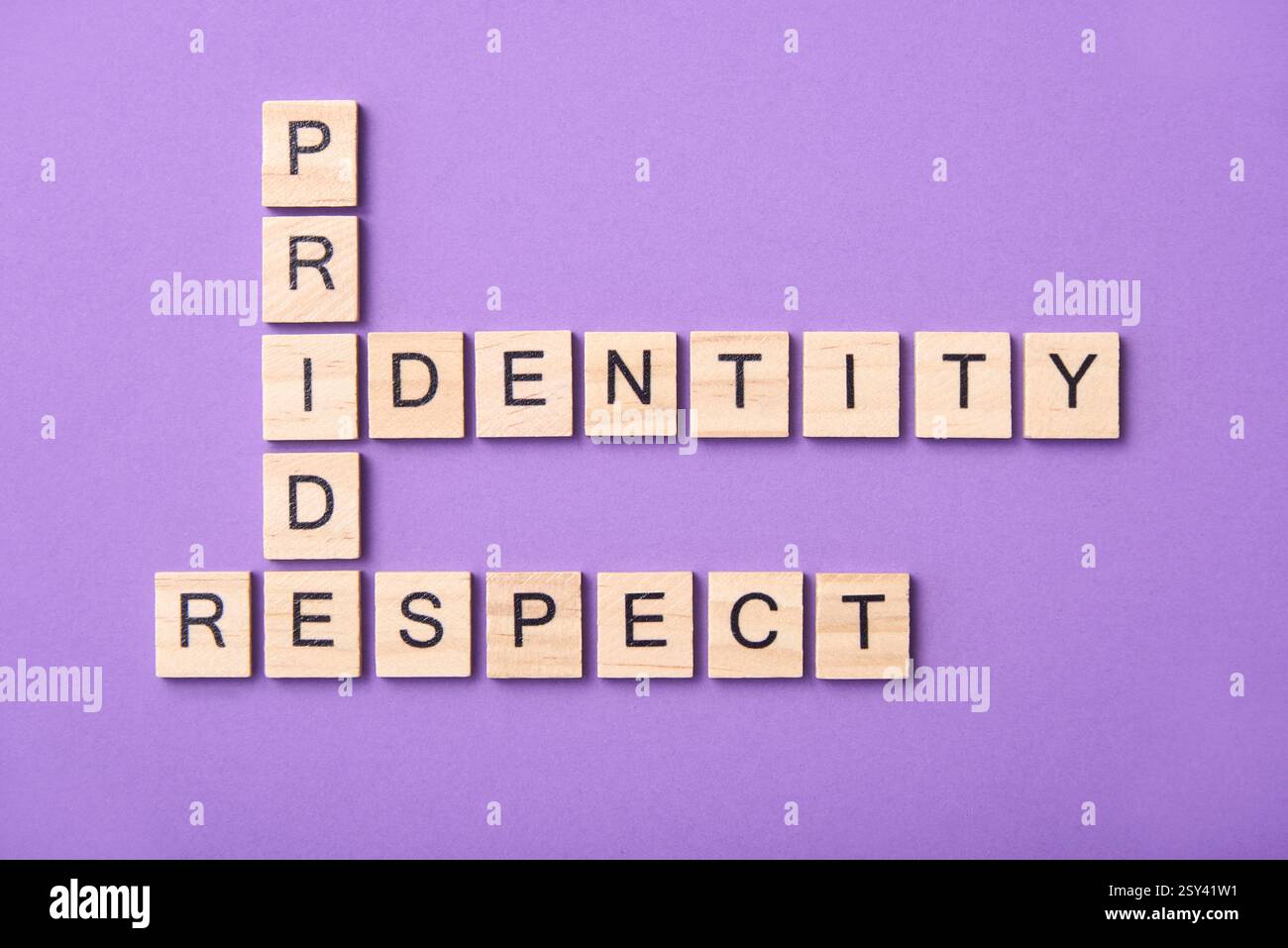 Wooden pieces with letters forming a crossword puzzle with the words ...