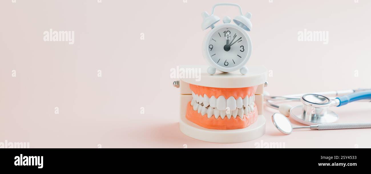 Dentist promotes healthcare awareness with a teeth model and alarm ...