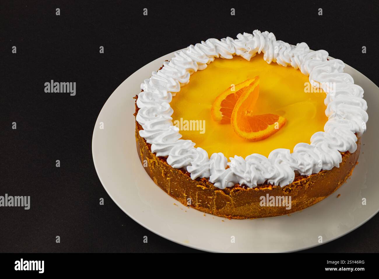 Enjoy a fresh homemade orange cheesecake, beautifully decorated with ...