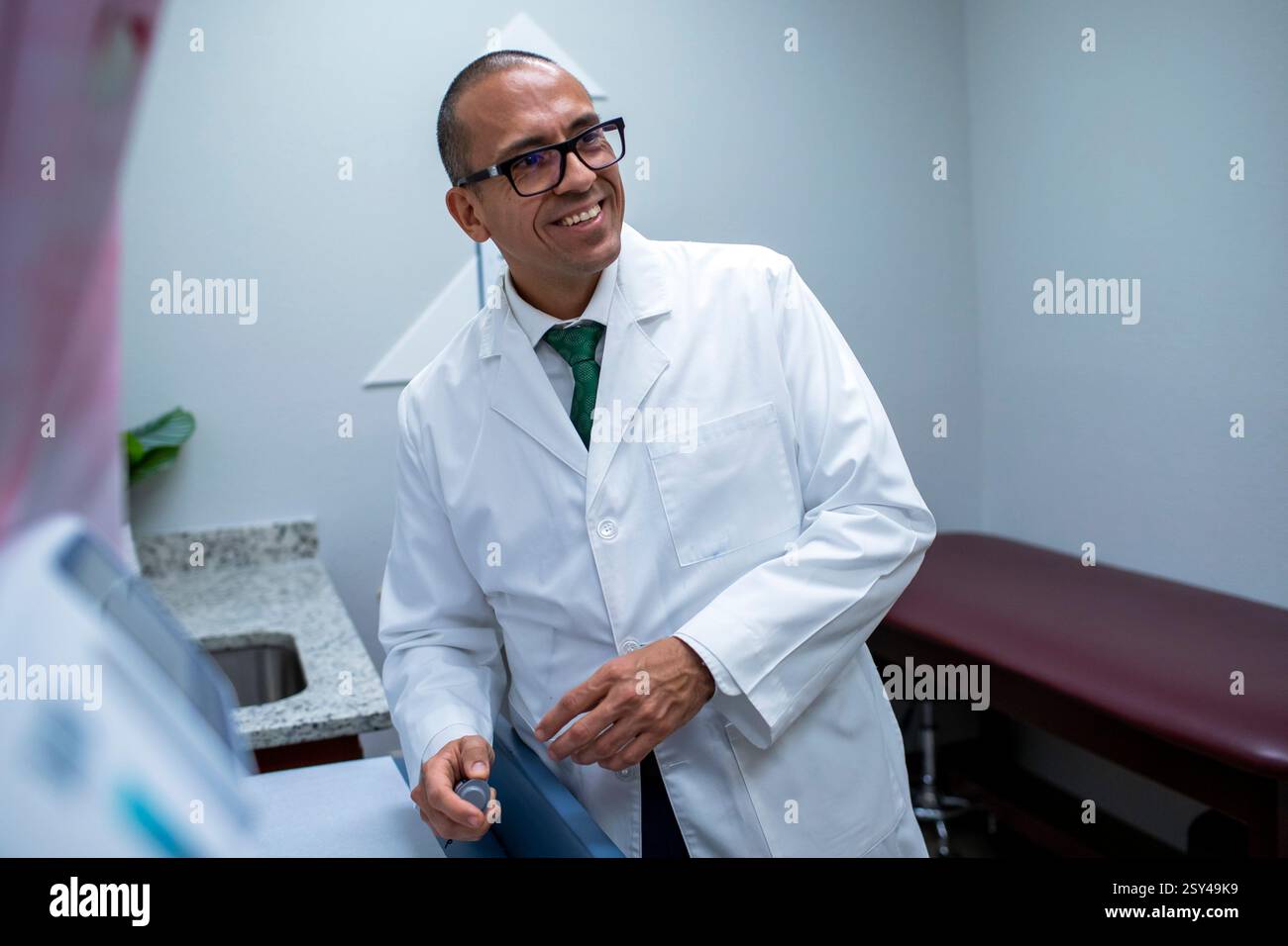 Pediatric endocrinologist Dr. Hector Granados speaks during an interview at his private practice ...