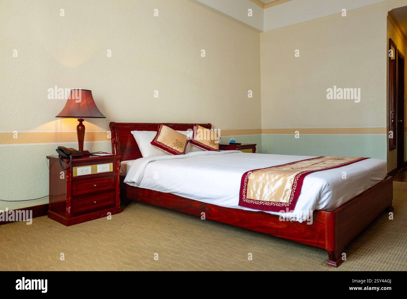 large queen rose wood bed hotel build colour white sheets two gold ...