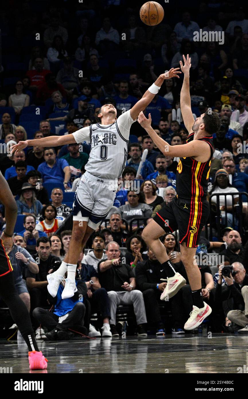 Atlanta Hawks forward Georges Niang (20) shoots as Orlando Magic guard Anthony Black (0) defends ...