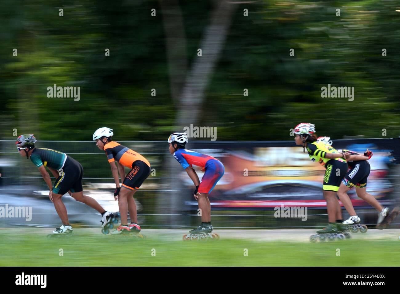 Roller skating team athletes at speed line Stock Photo - Alamy