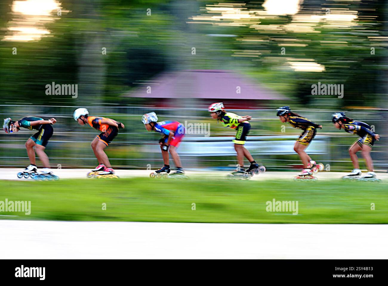 Roller skating team athletes at speed line Stock Photo - Alamy