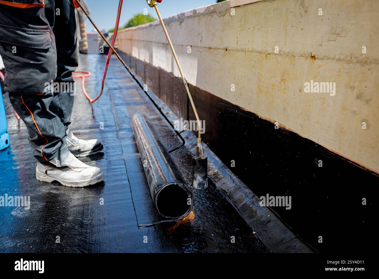 Worker is unroll rolled up, sheet of waterproofing installation ...