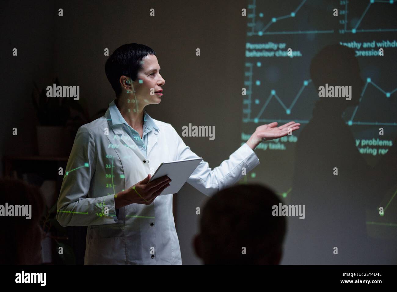 Side view portrait of professional female scientist giving presentation ...